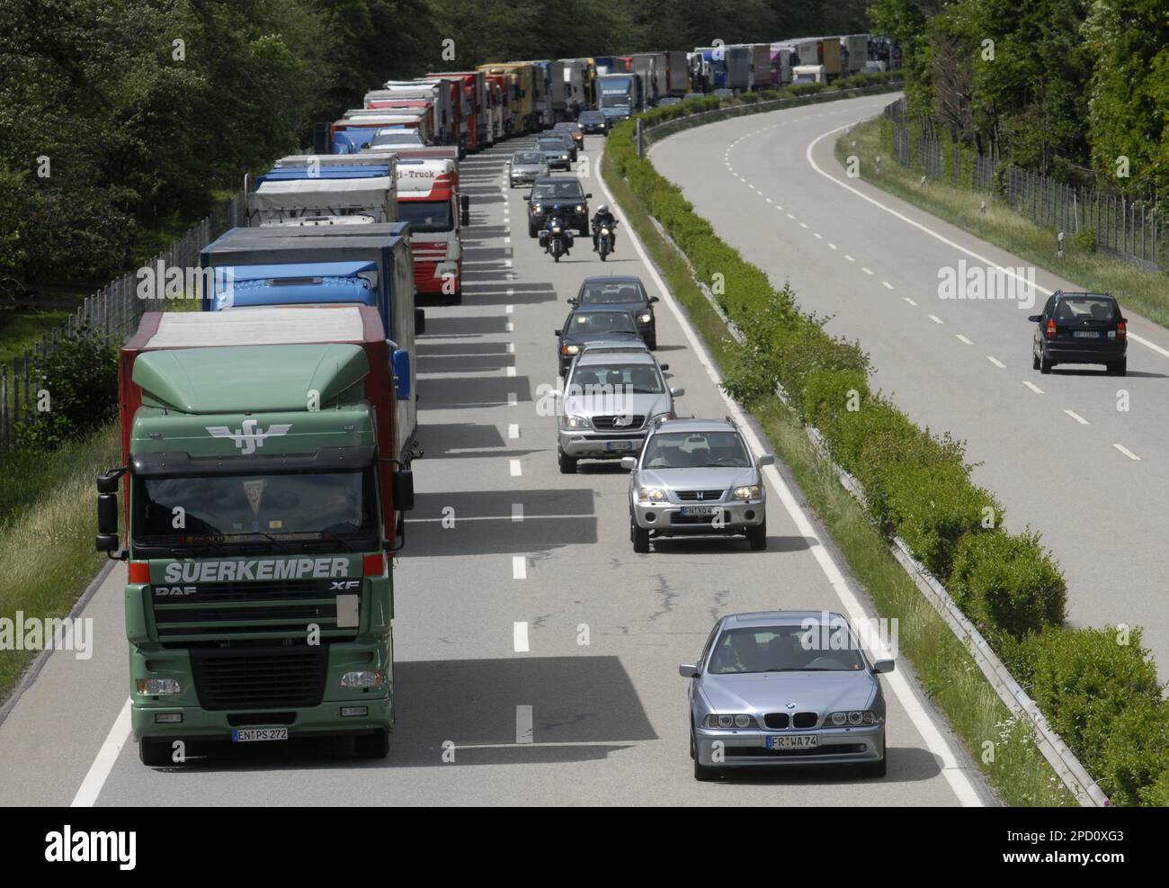 Trucks and cars are caught in a traffic jam on the highway A13 in ...