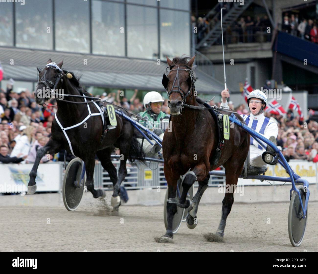 French jockey Christophe Gallier, right reacts following his victory ...