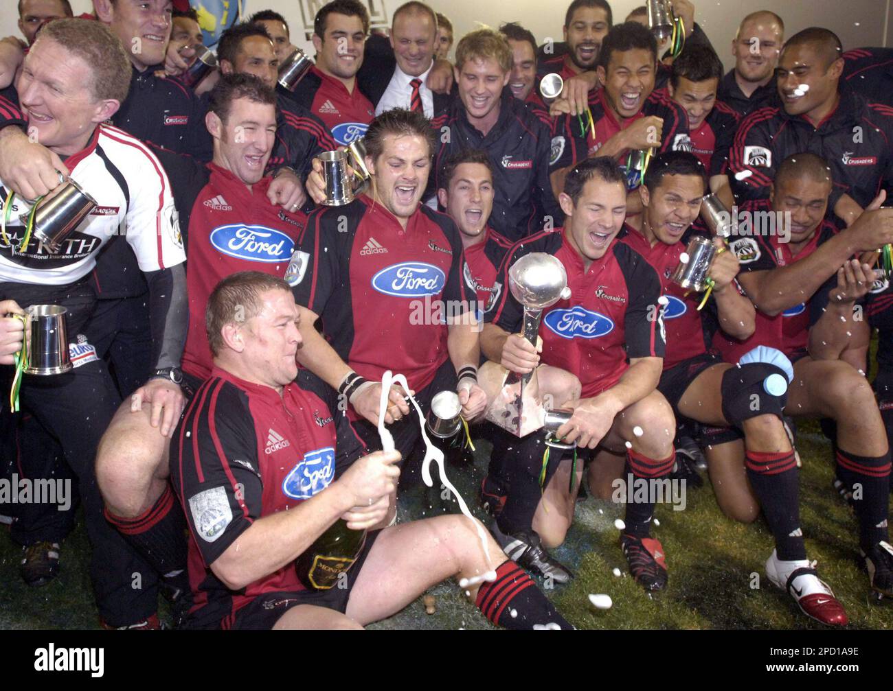 Richie McCaw, second row, third from left, and the Crusaders celebrate ...