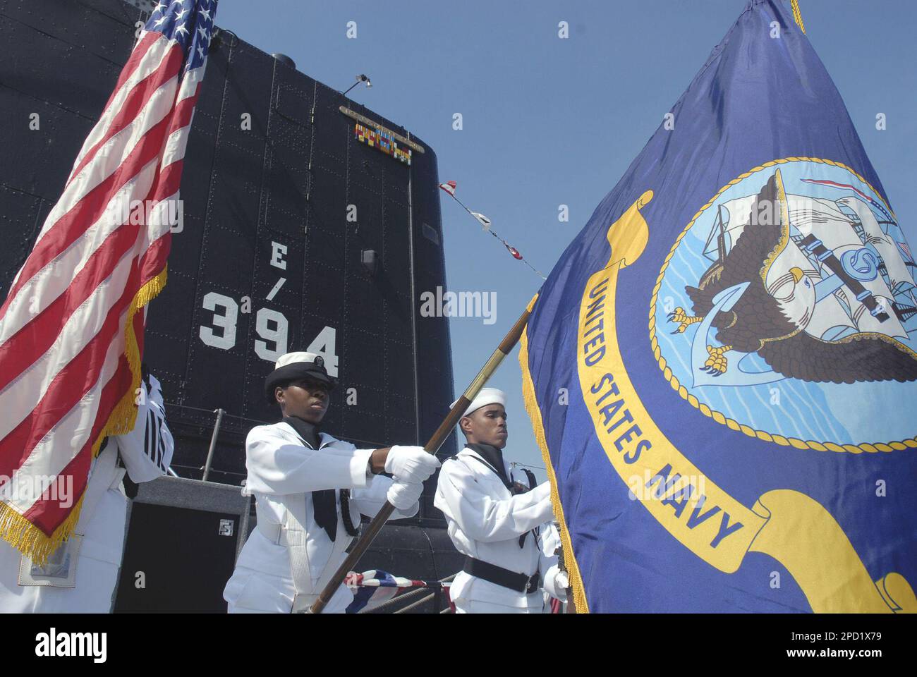 U.S. Navy sailors Yvonda Handley, center, and Carlton Riley, right ...