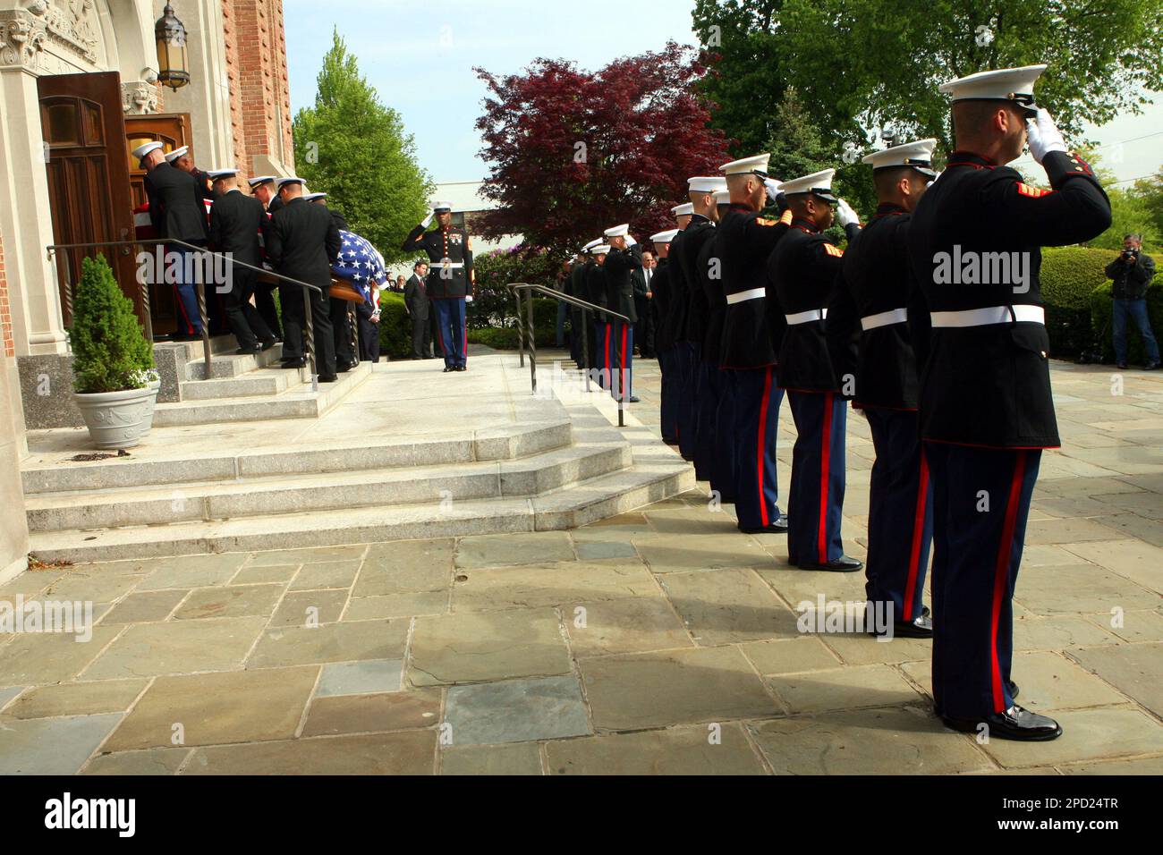 Members of the Marine Corp.Honor Guard salute as the coffin of Marine ...