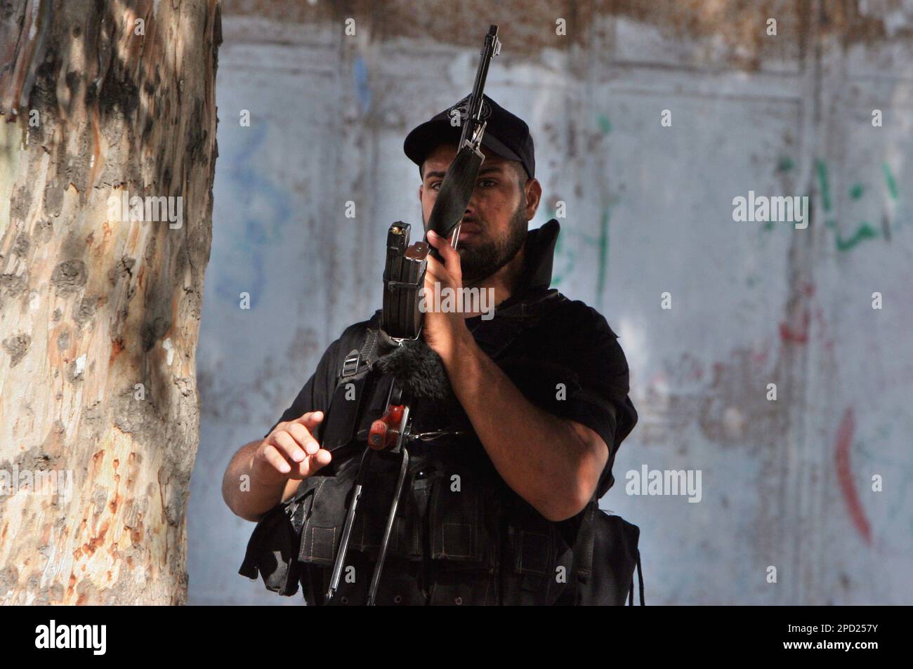 A member of the new security forces of the Hamas-led Palestinian ...
