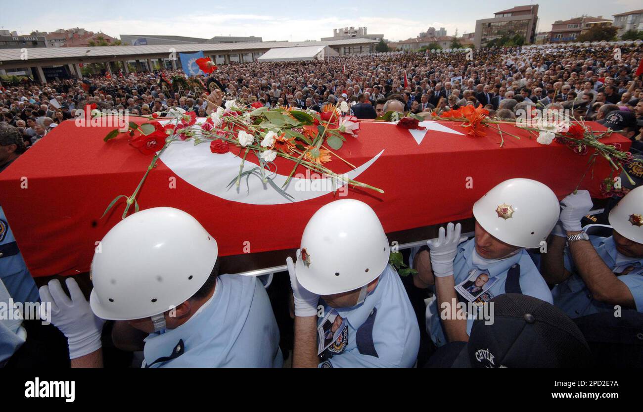 Police officers carry the coffin of Judge Mustafa Yucel Ozbilgin of ...