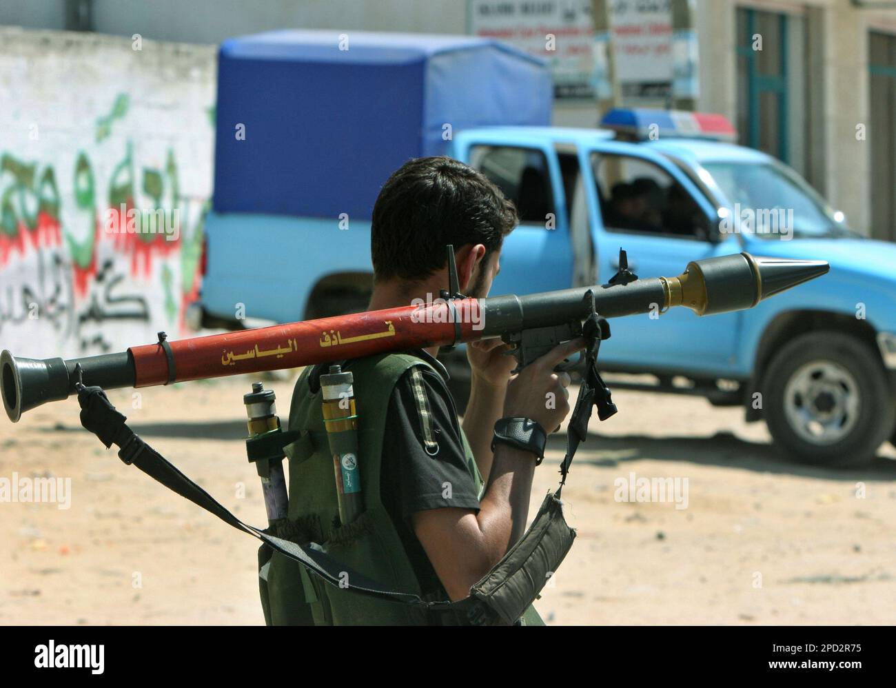 A Palestinian militant of the Islamic group Hamas, carrying a RPG ...