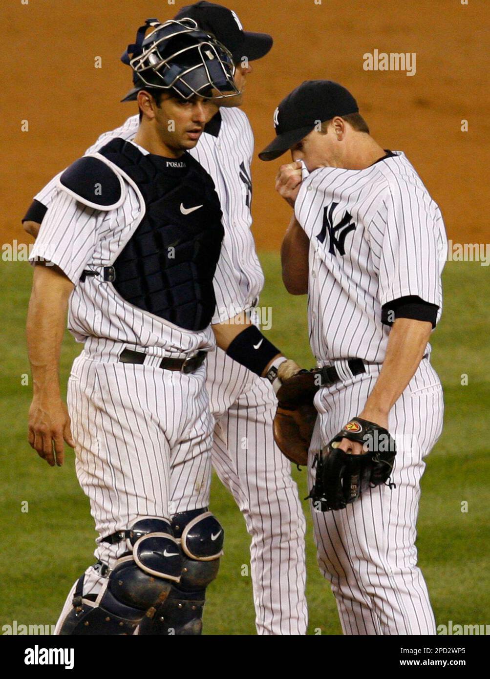 New York Yankees catcher Jorge Posada, left, consoles pitcher Scott ...