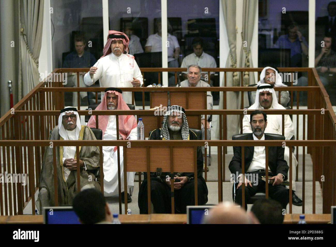Barzan Ibrahim, back left, addresses the court as first row left to ...