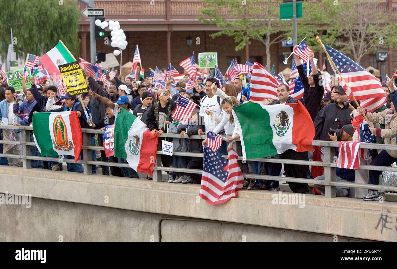 Immigration rights demonstrators rally on a freeway overpass in ...