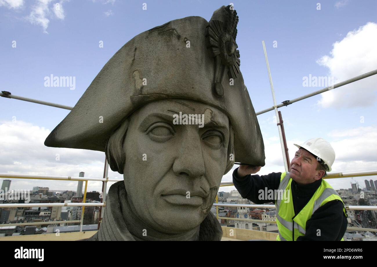 Cleaning supervisor Bob Egan inspects the head of Admiral Lord Nelson ...