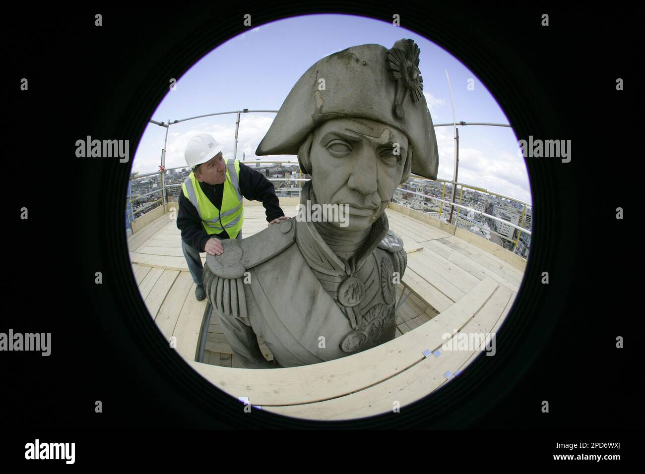 Cleaning supervisor Bob Egan inspects the top of Nelson's Column ...