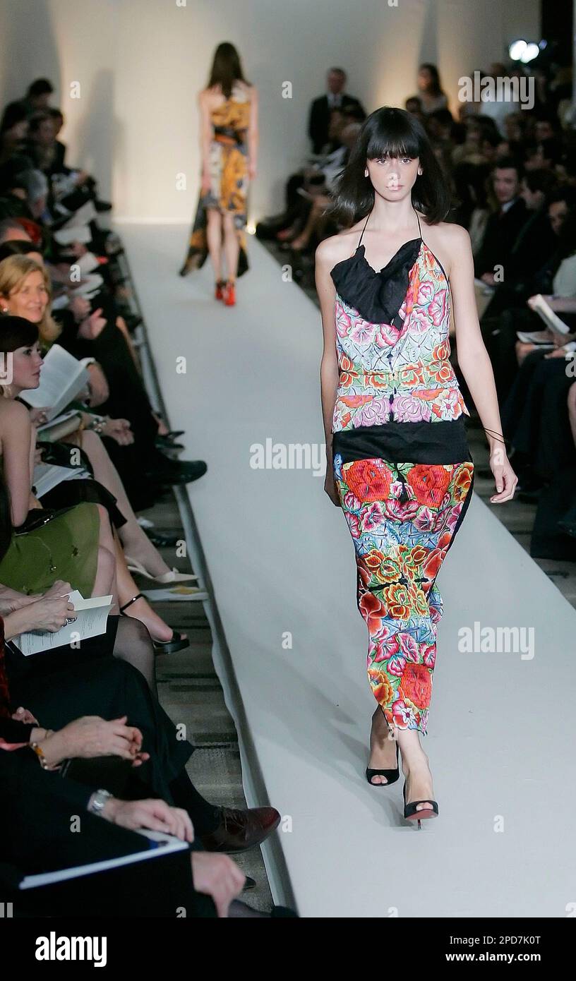 Models walk the runway during the Fashion For Development Show, Monday ...