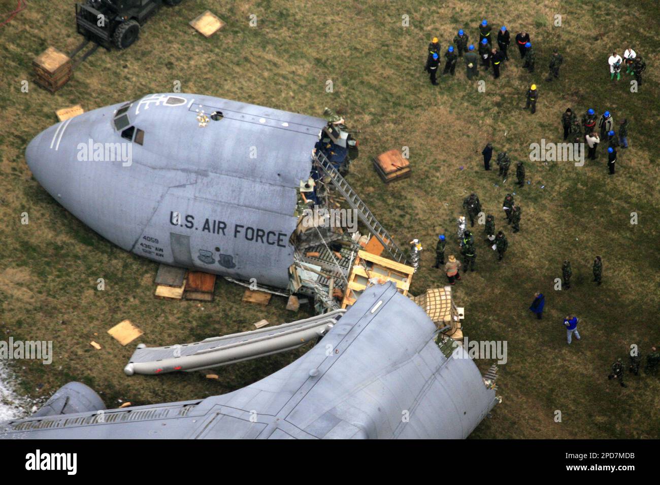 Emergency crews respond to the scene of a C-5 Galaxy cargo plane that ...