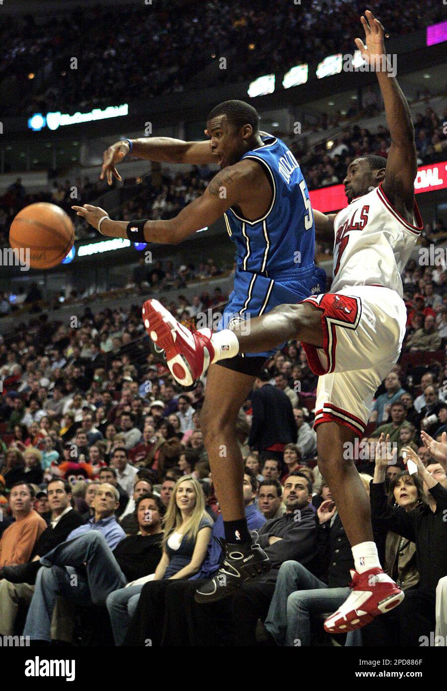 Orlando Magic's Keyon Dooling, left, tries to save a ball against ...