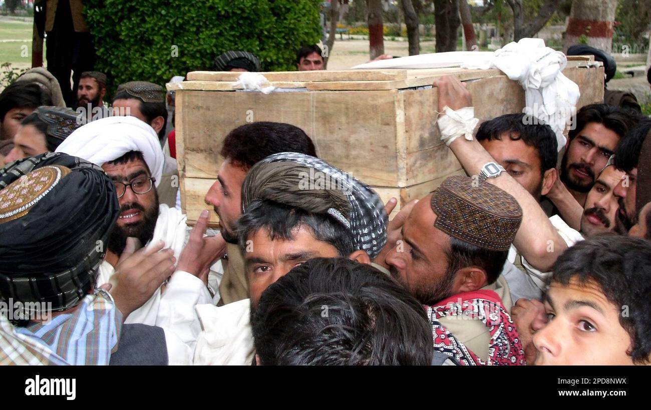 People carry a dead body of a Pakistani tribal member who was allegedly ...