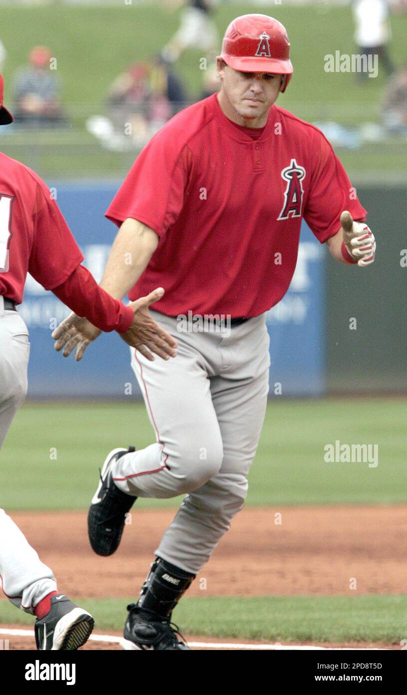 Los Angeles Angels' Tim Salmon, right, is congratulated by third base ...