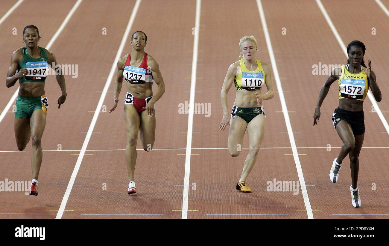 Jamaica's Sheri-Ann Brooks, right, runs to the line on her way to ...