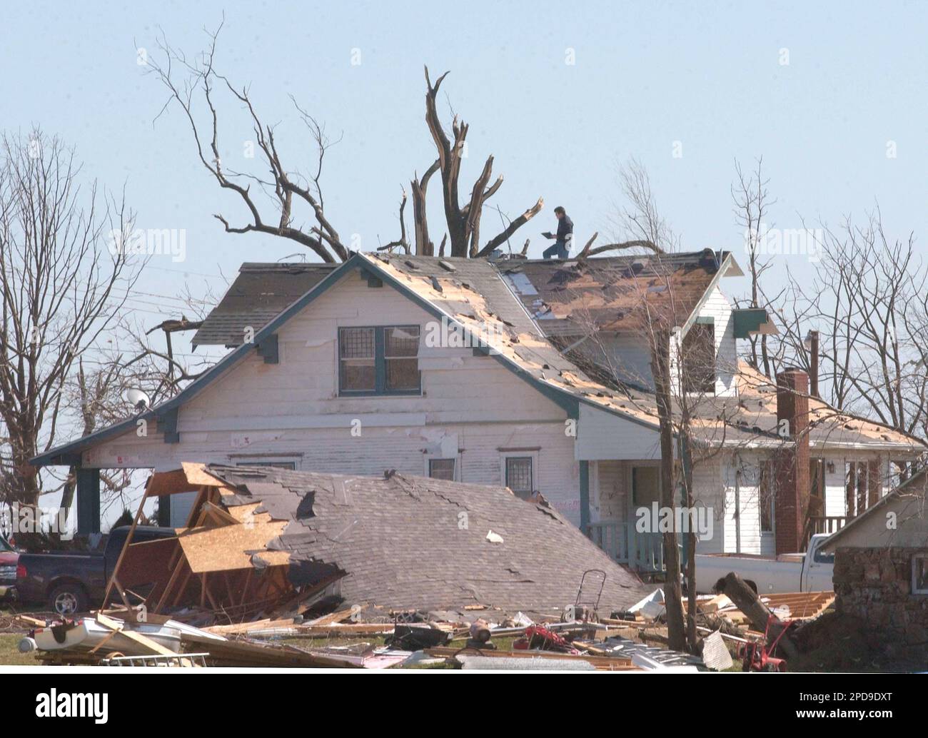 Contractor David Sands assesses the roof of Wayne Hatton's 90-year-old ...