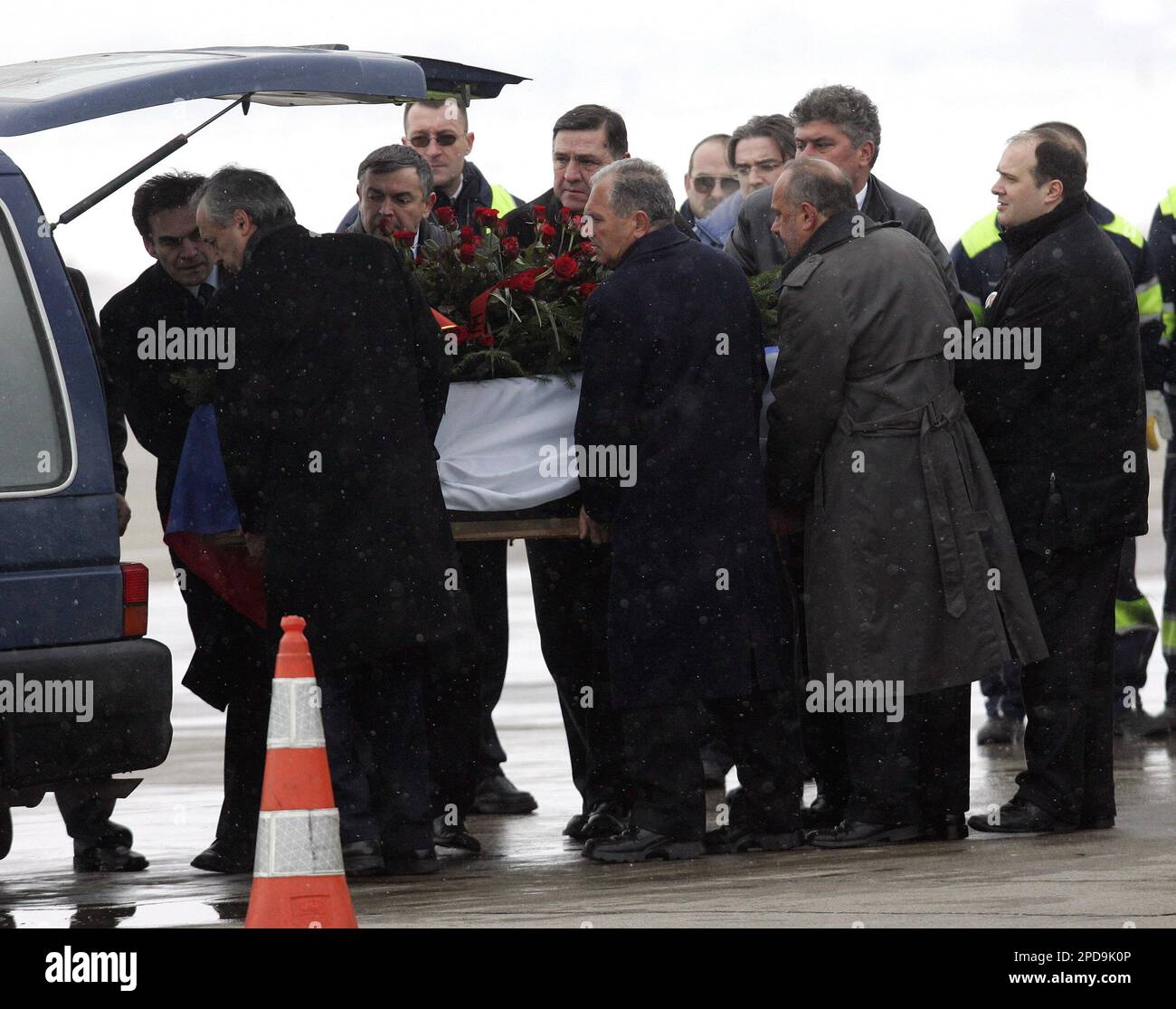 Socialist party officials carry the coffin of late Serbian and Yugoslav ...