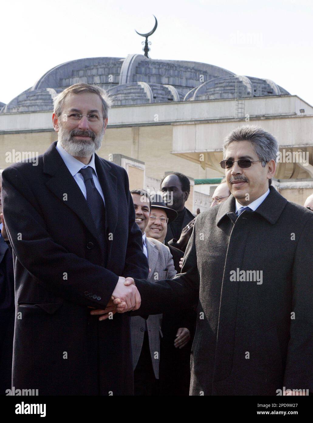 Rome's chief Rabbi Riccardo Di Segni, left, shakes hands with Abdellah ...