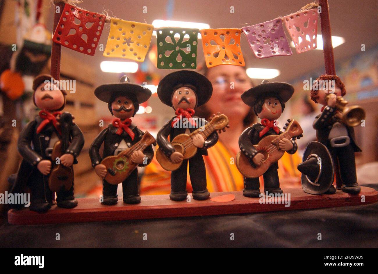 Pictured is a miniature mariachi made of porcelain at Lupita Castro ...
