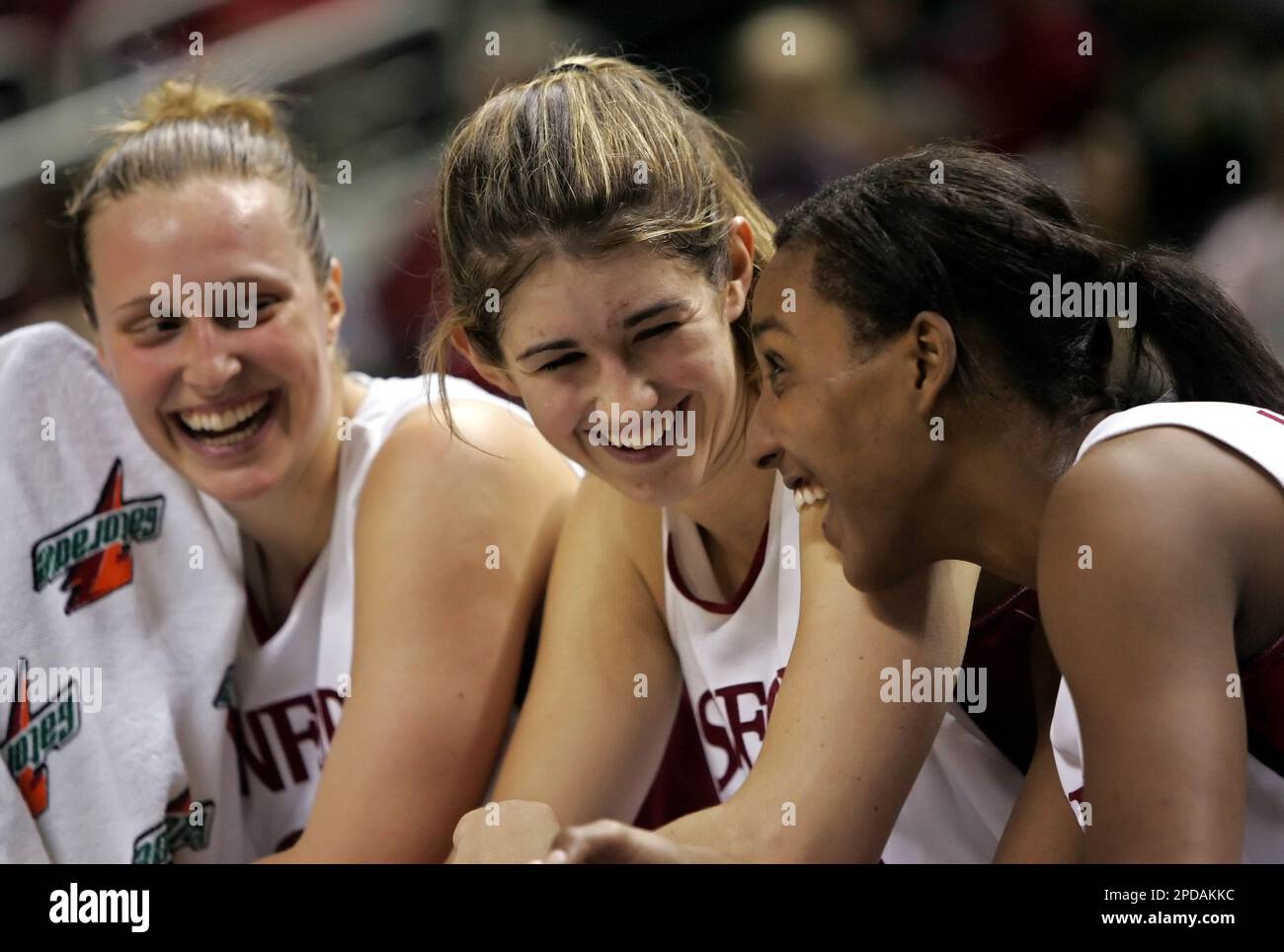 Stanford center Brooke Smith, center, smiles with guard Candice Wiggins ...