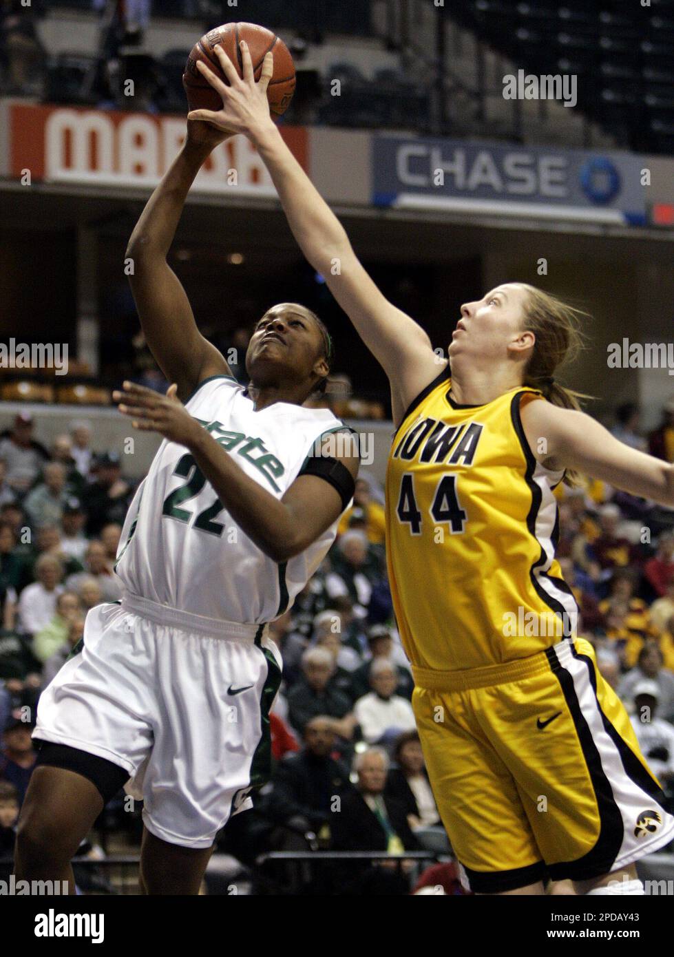 Michigan State's Aisha Jefferson, left, is fouled by Iowa's Megan ...