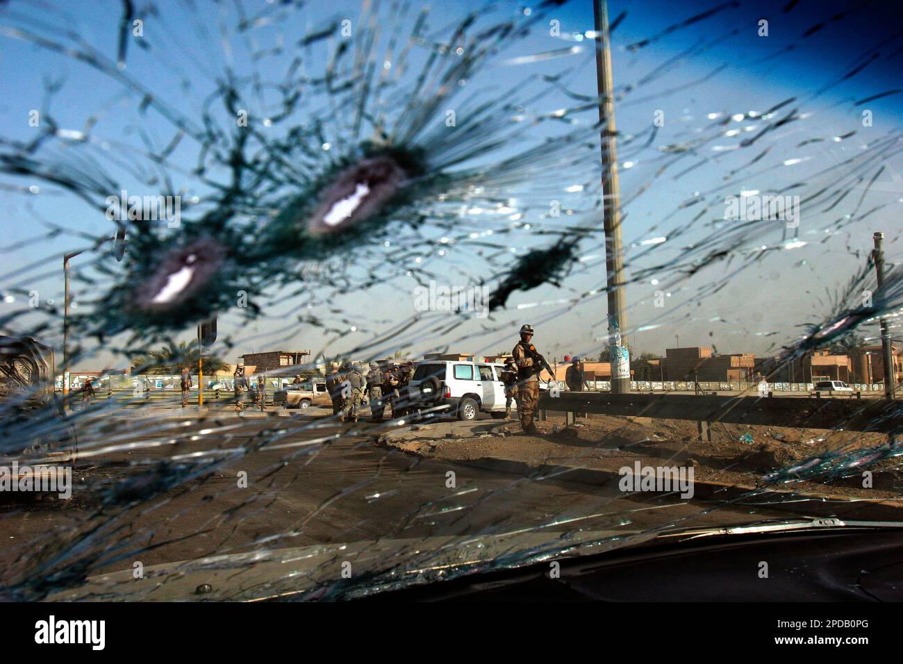 Bullet ridden wind screen of one of the car in a convey escorting Iraqi ...