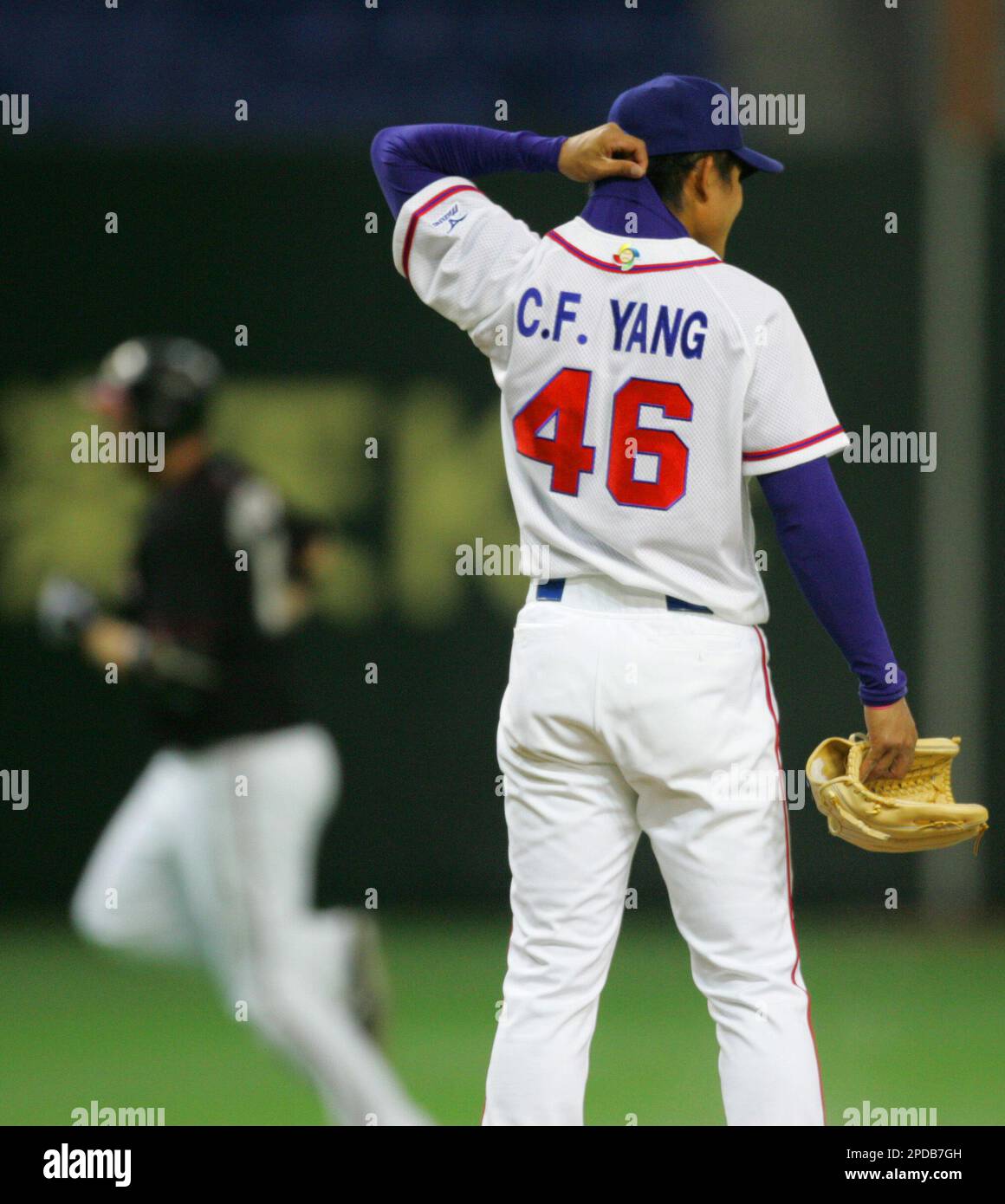 Taiwan WBC team's Yang Chien-Fu (46) reacts after giving Val Pascucci of Japan's Lotte Marines ...
