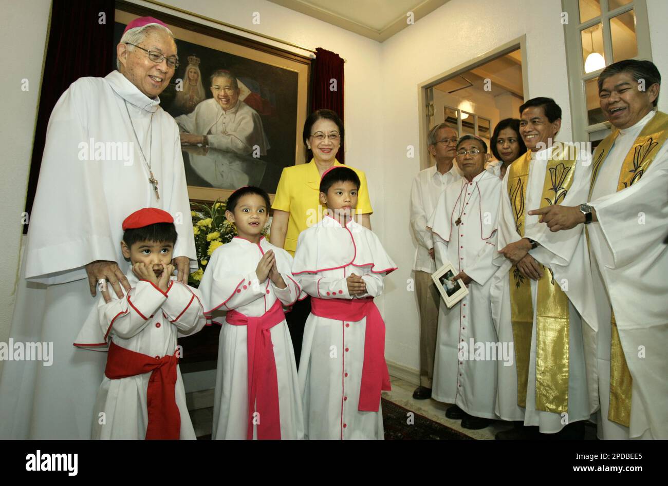 Former President Corazon Aquino, center, stands at the unveiling of a ...