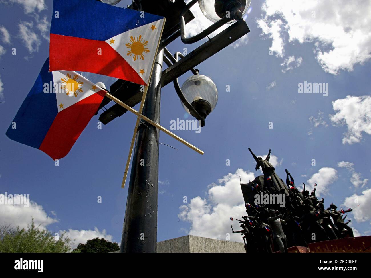 Philippines national flags wave near the People Power Monument, a ...