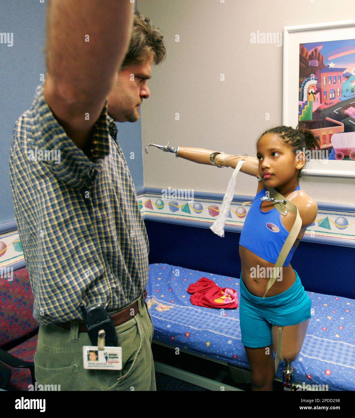 Victoria Salcedo-Portocarrero, right, of Ecuador, raises her new ...