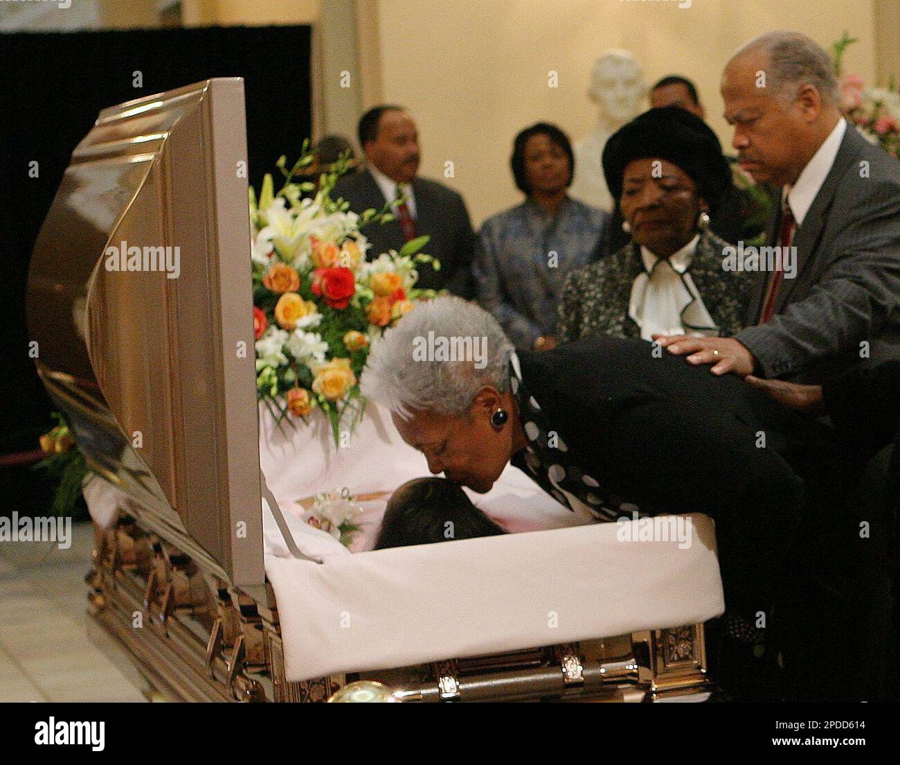 Naomi King, widow of Rev. A.D. King, leans over to kiss Coretta Scott ...