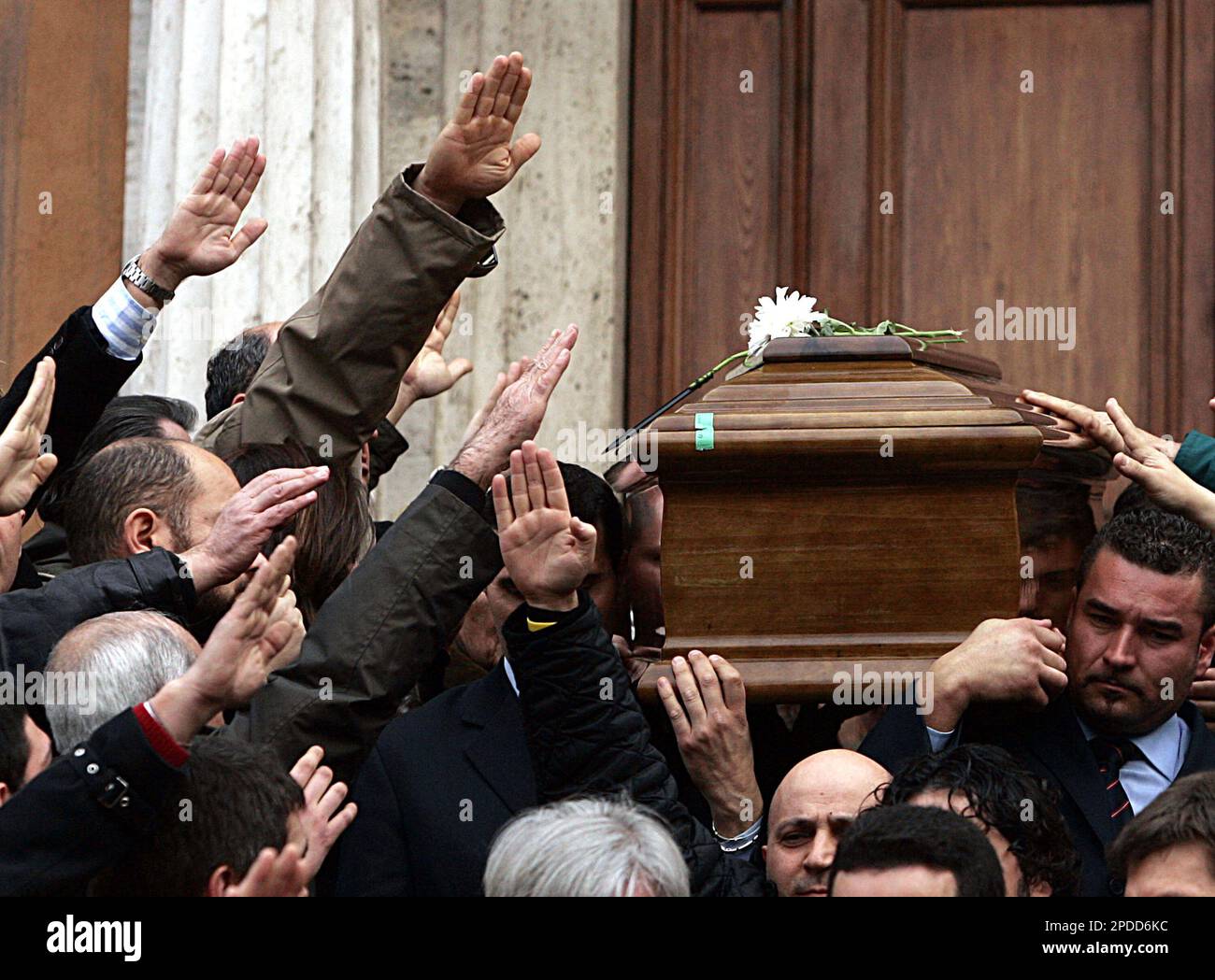 People greet the coffin of Romano Mussolini with fascist salutes ...
