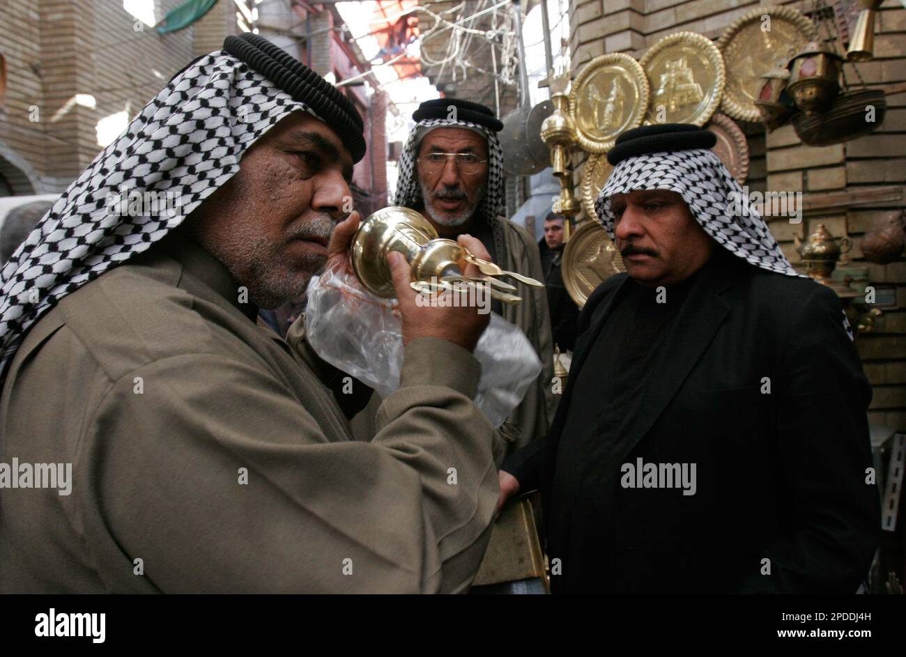 Local Shiite Muslims buy ornaments to honor the first day of the ...