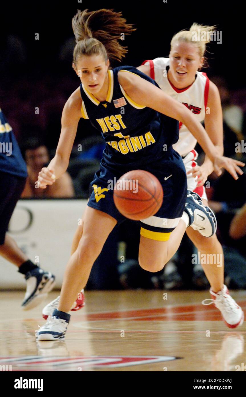 West Virginia's Meg Bulger, left, steals the ball from St. John's Tiina ...
