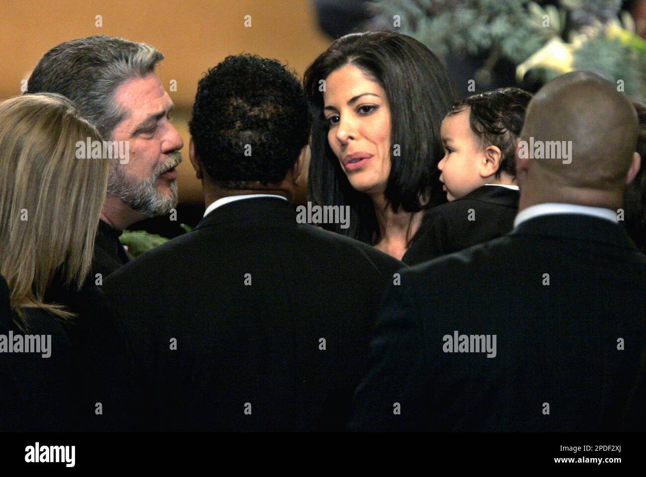 Nina Rawls, widow of singer Lou Rawls, holds her young son Aiden as ...