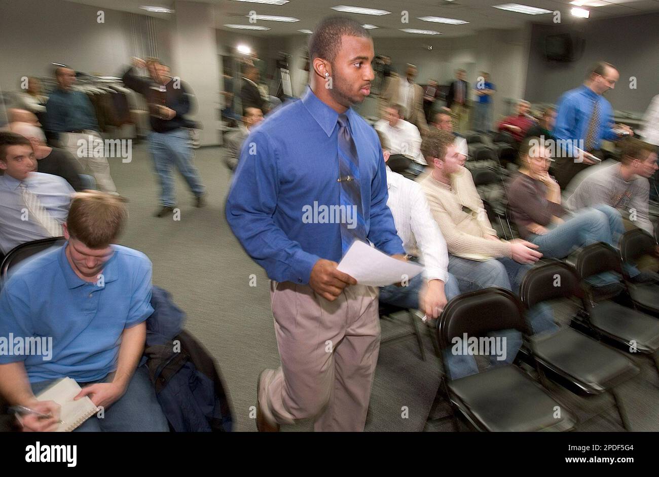 Wisconsin running back Brian Calhoun makes his way into a news ...