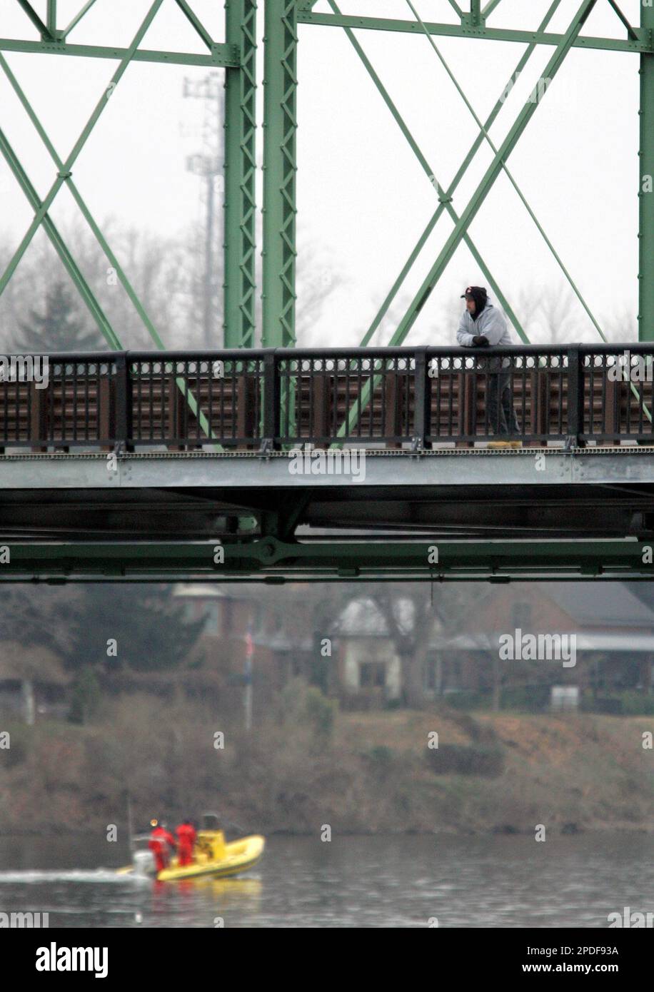 A man watches from the Lambertville-New Hope bridge connecting New ...