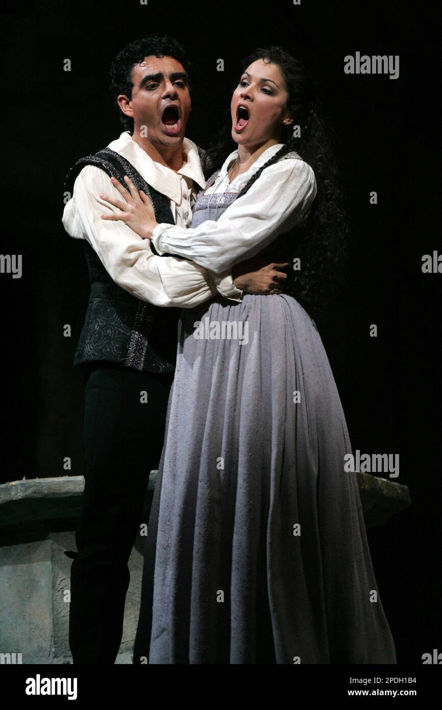 Anna Netrebko, right, performs as Gilda alongside Rolando Villazon ...