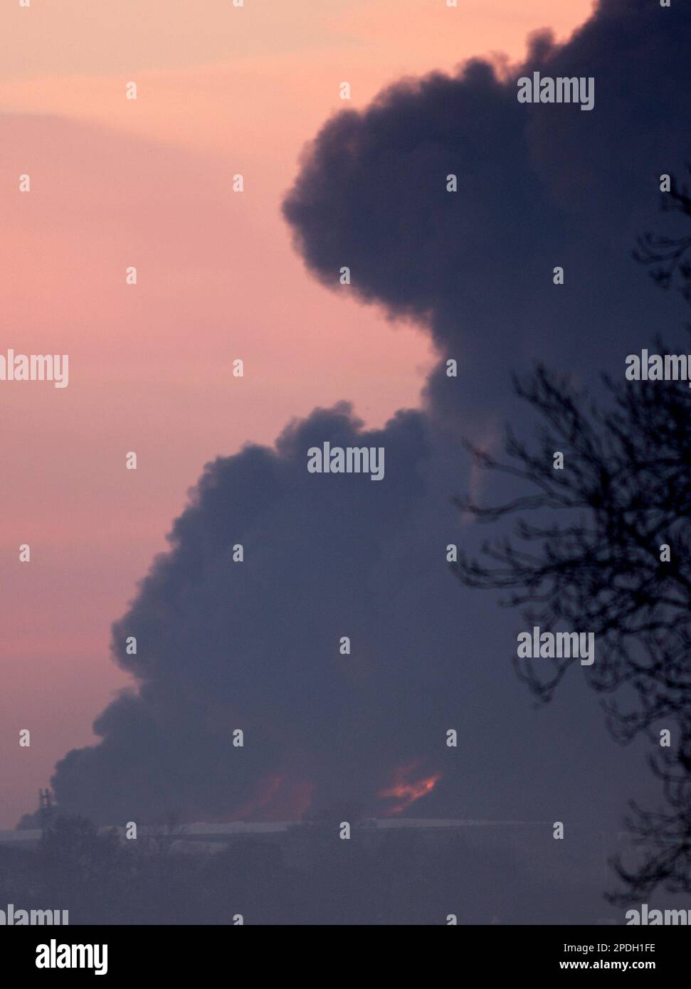 Smoke and flames continue to rise above the Buncefield Oil Terminal in ...