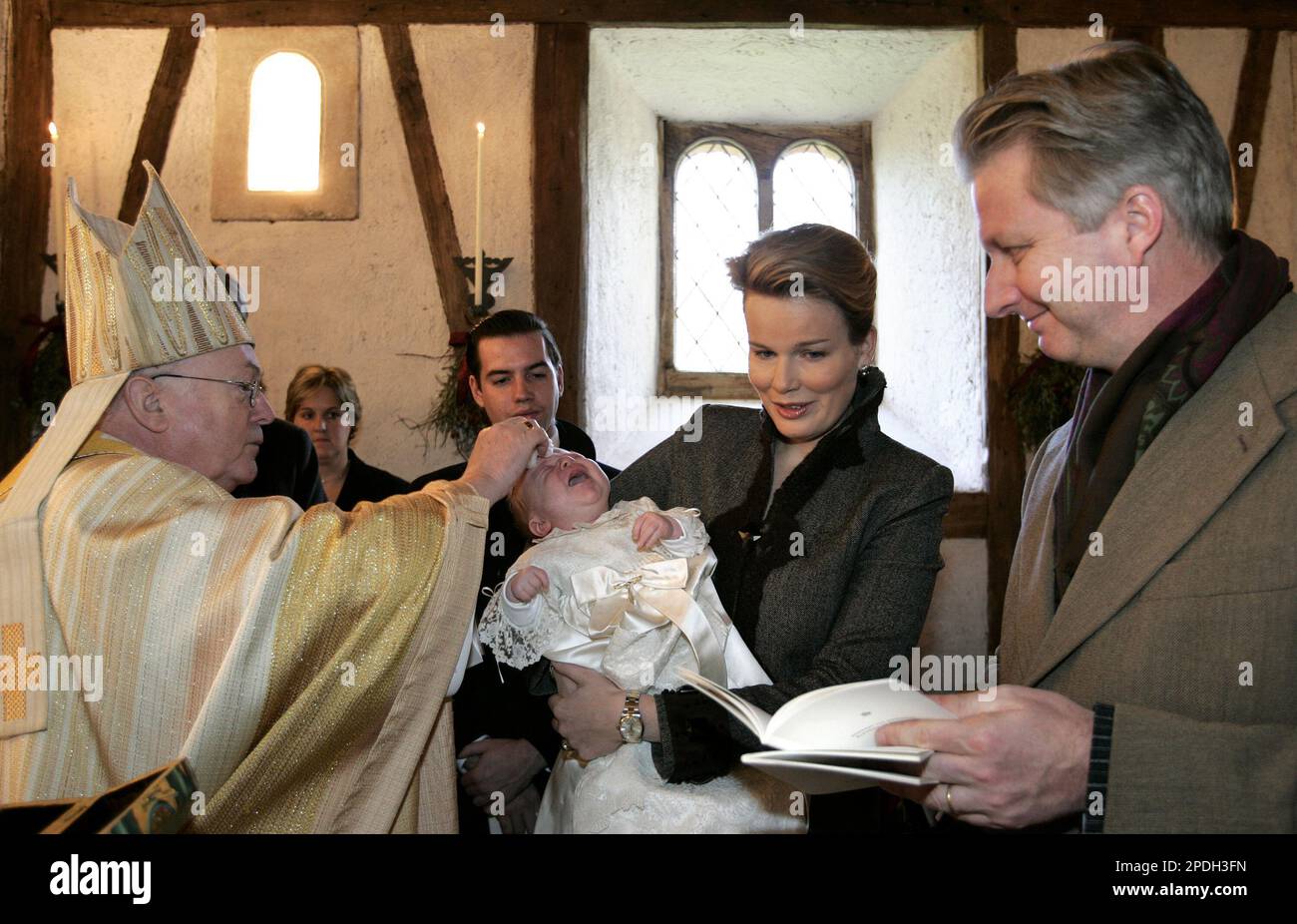 Belgium's Cardinal Daneels, left, performs the baptism ceremony for ...