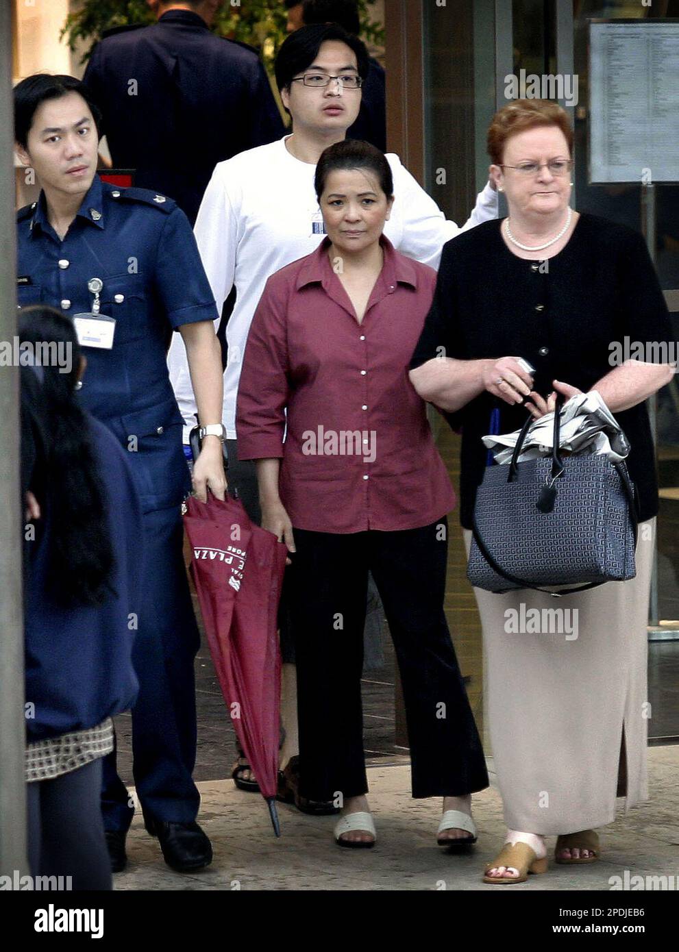 Kim Nguyen, center, walks out of Singapore's Changi Prison with her son ...