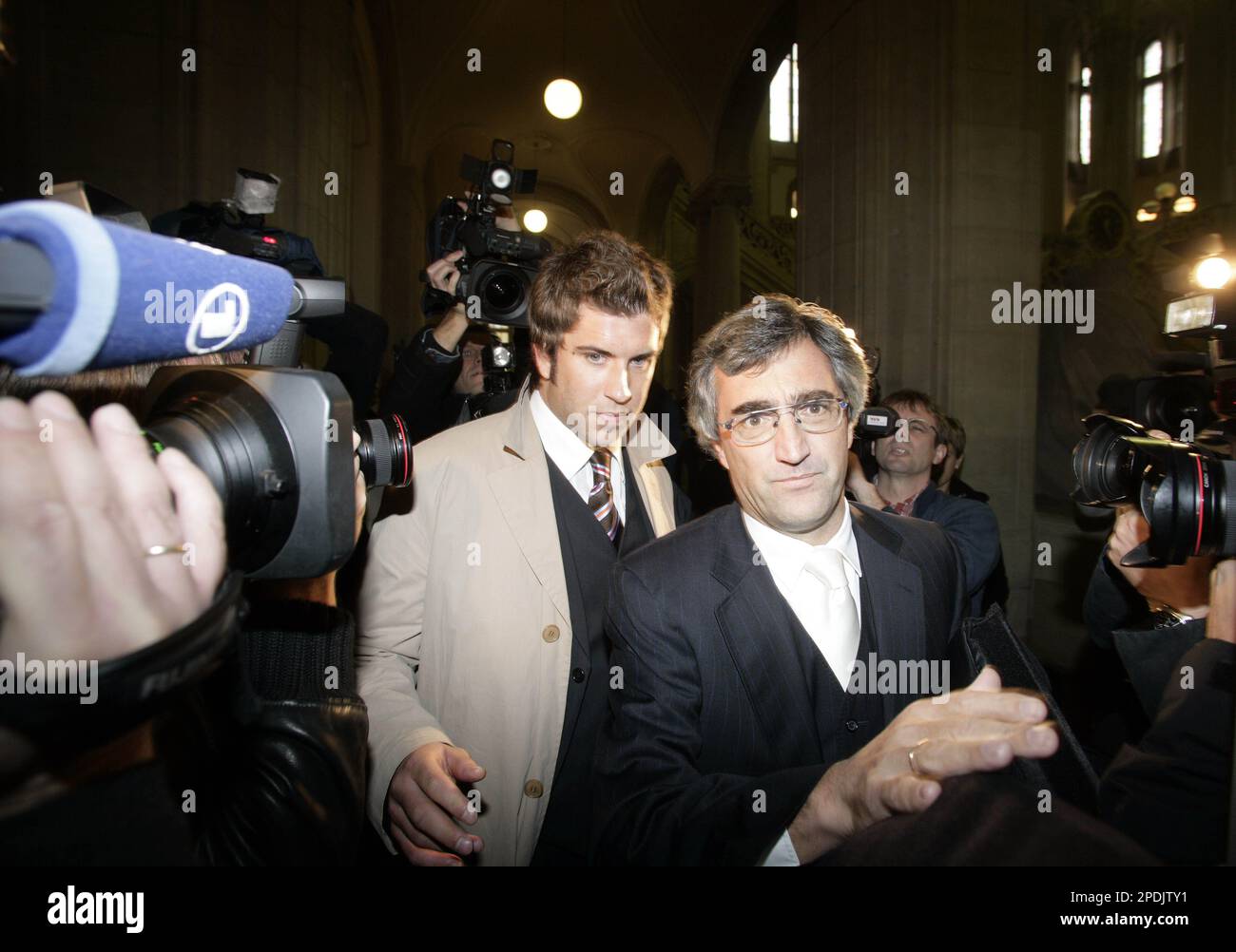Former soccer referee Robert Hoyzer, left, and his attorney, right ...
