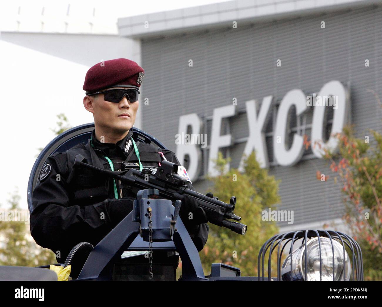 A South Korean special police officer guards on an armored vehicle at the BEXCO Convention ...