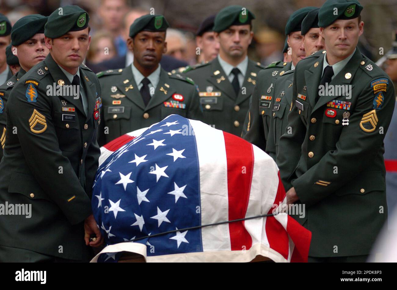 Fellow Special Forces soldiers carry the coffin of their comrade, Capt ...