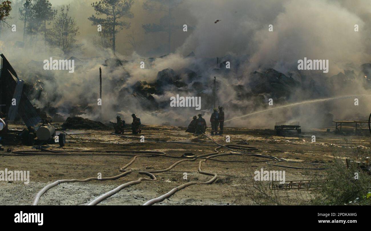 Crews from 19 different fire departments work to extinguish a barn fire ...