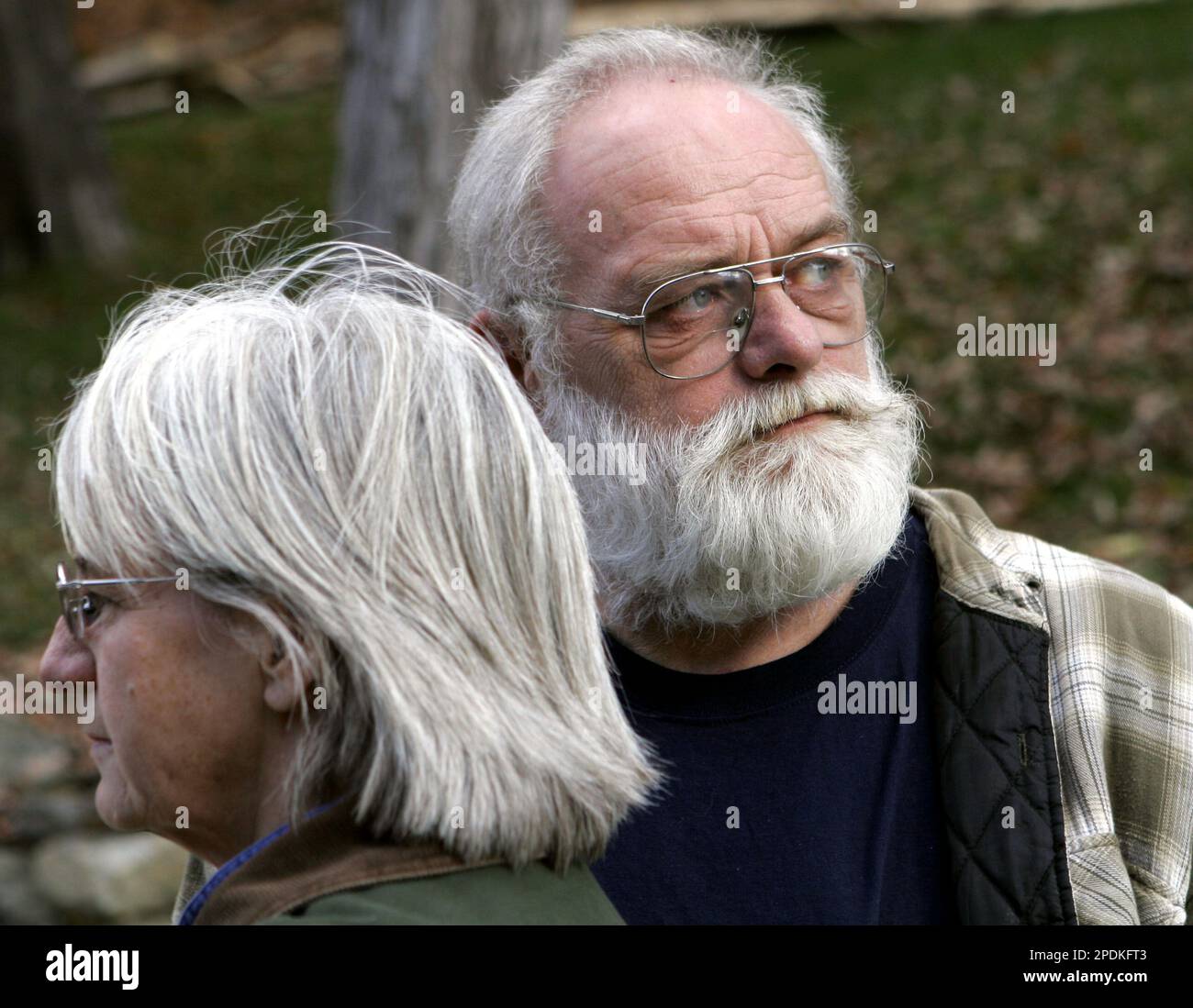 Ernest Perry, standing with his wife Sharon, looks upstream from his ...