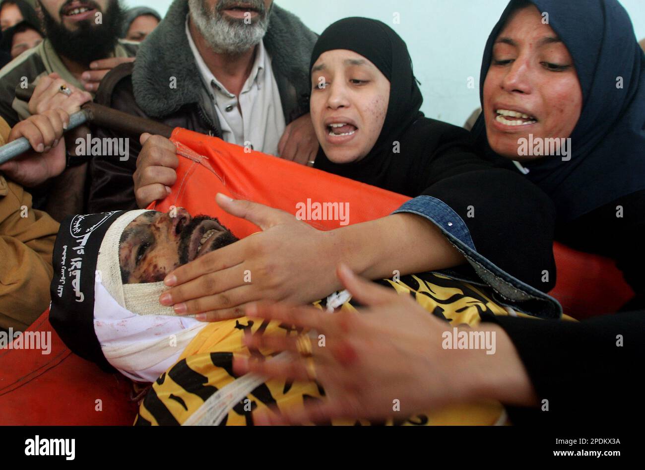 Relatives react in the presence of the body of Hassan Madhoun, a leader ...
