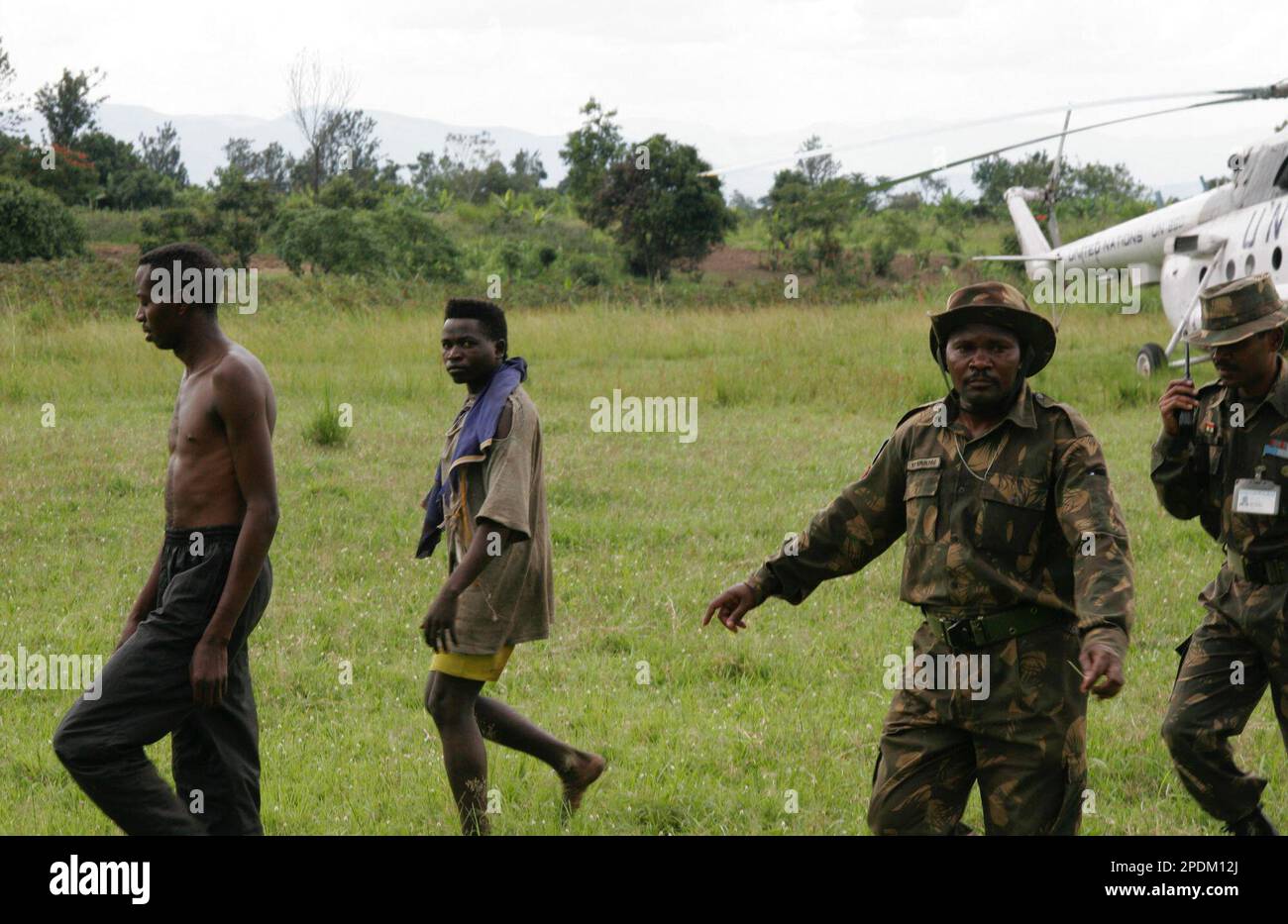 Two unidentified Rwandan Hutu rebels, left, that were captured during a ...