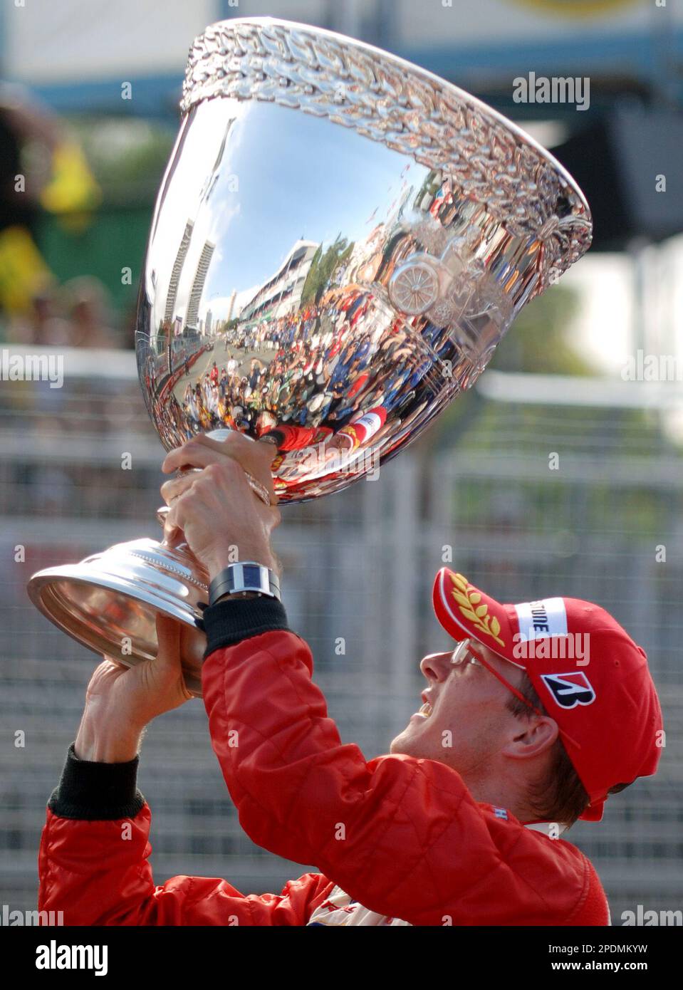France's Sebastien Bourdais holds the Vanderbilt trophy aloft for ...