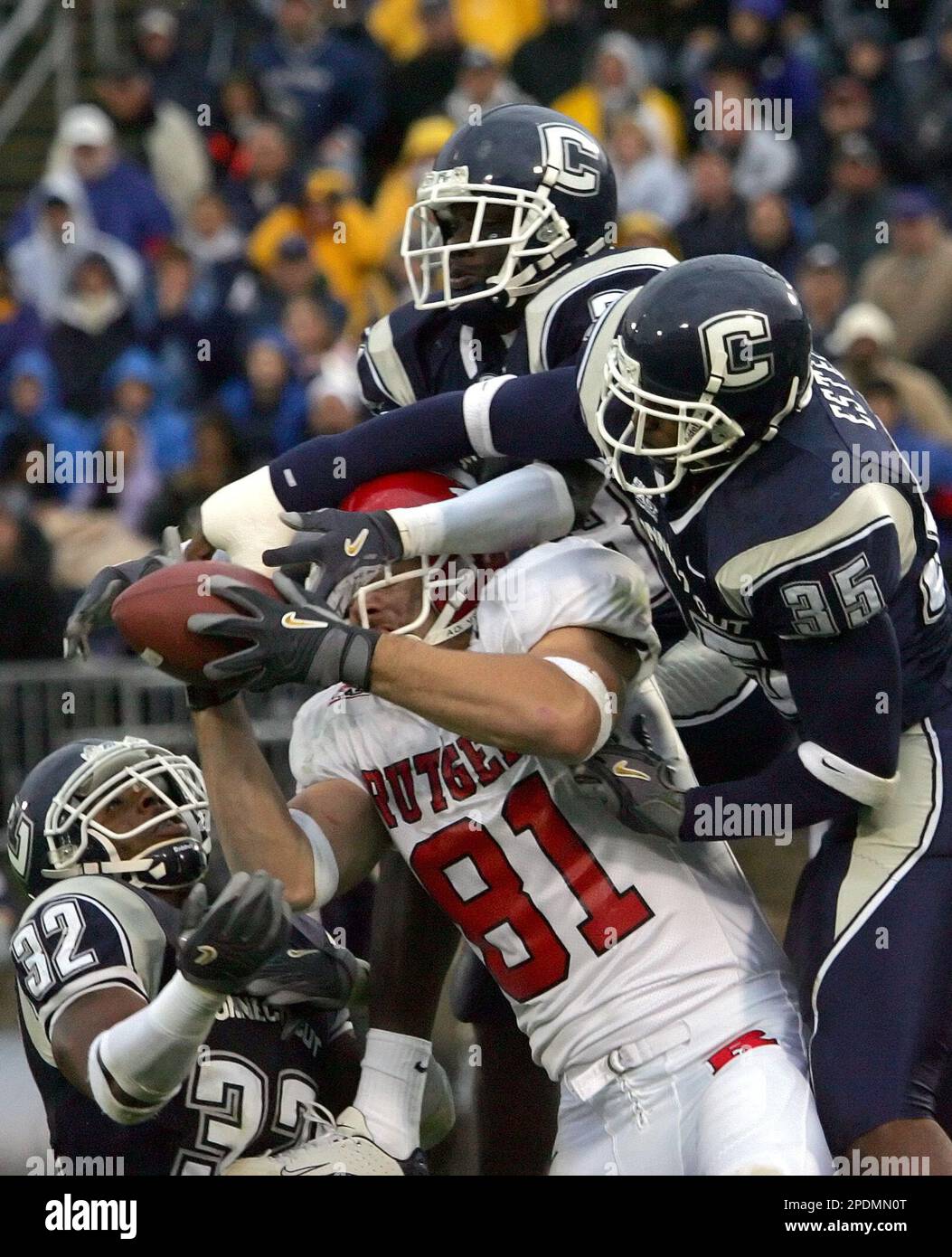 Rutgers' Clark Harris (81) hauls in a pass as Connecticut's James ...